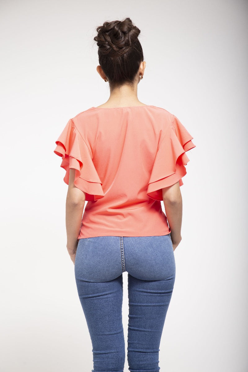 Blusa mamey con moño, de manga corta con holanes en tela lisa – Ciudadela